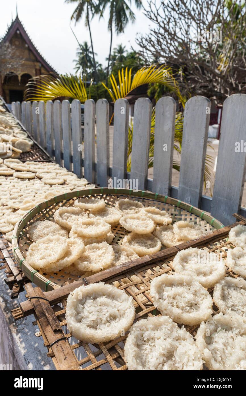 Laos, Luang Prabang. Sticky rice cakes, Buddhist monk alms offering ...