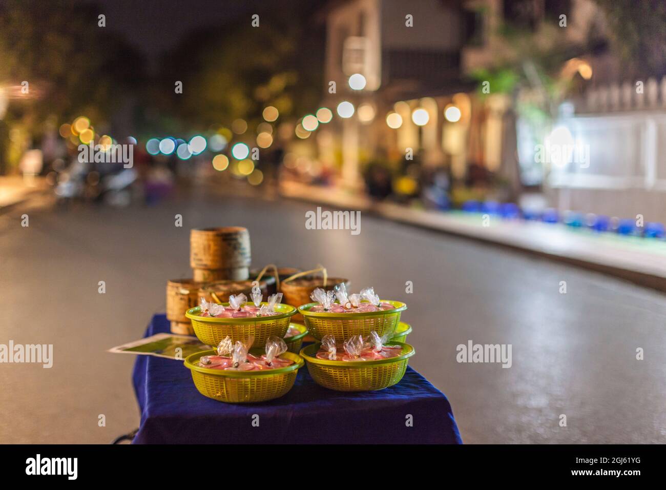 Laos, Luang Prabang. Tak Bat at dawn, procession of Buddhist monks ...