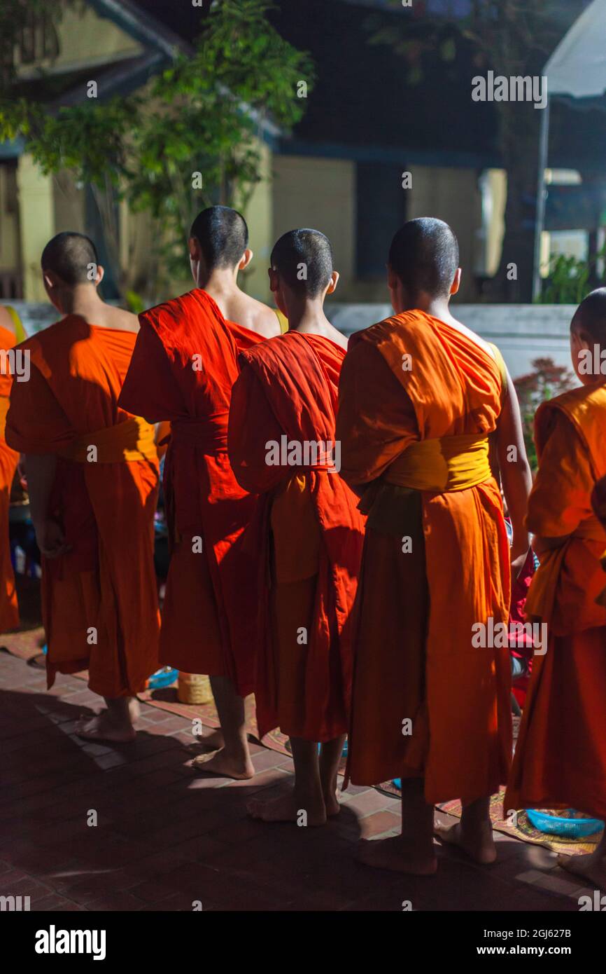 Laos, Luang Prabang. Tak Bat at dawn, procession of Buddhist monks ...