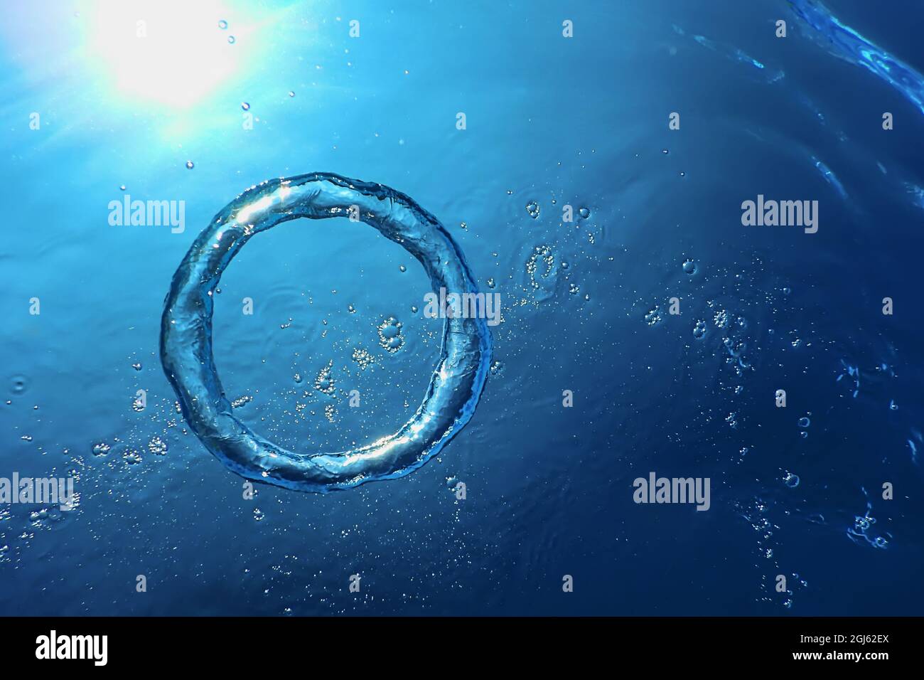 Underwater Bubble Ring Ascends towards the Sun Stock Photo - Alamy