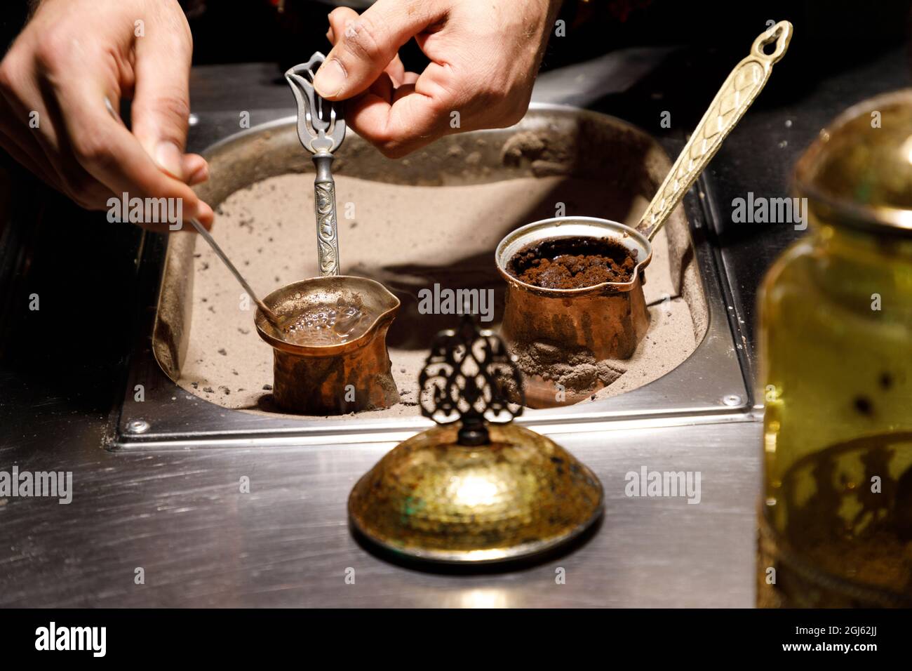 State of Qatar, Doha. Traditional Middle East coffee making Stock Photo ...