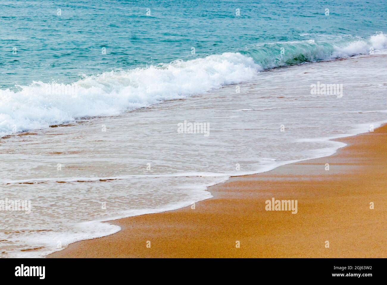 Light surf hitting the beach Stock Photo - Alamy