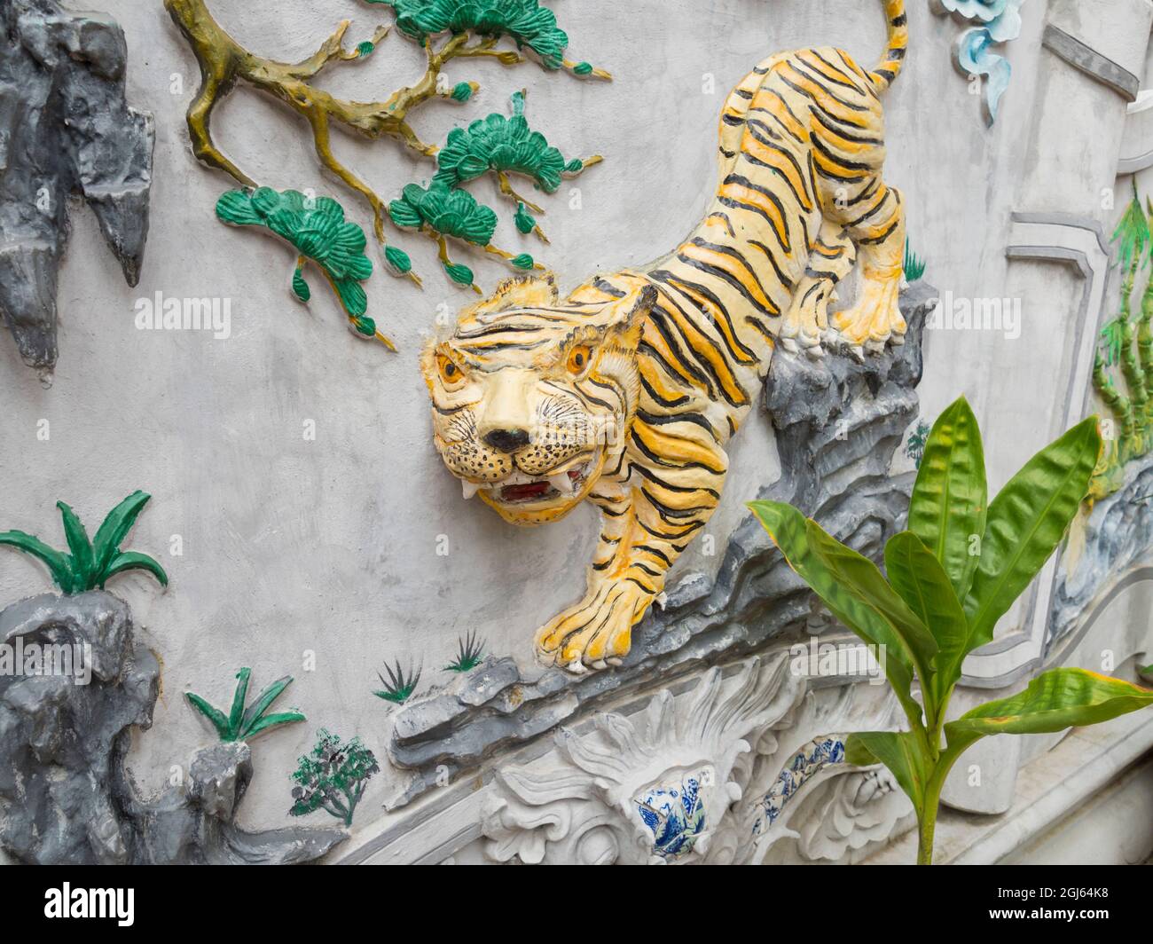 Vietnam, Hanoi, Old Quarter. Relief carving of a tiger on a wall Stock ...