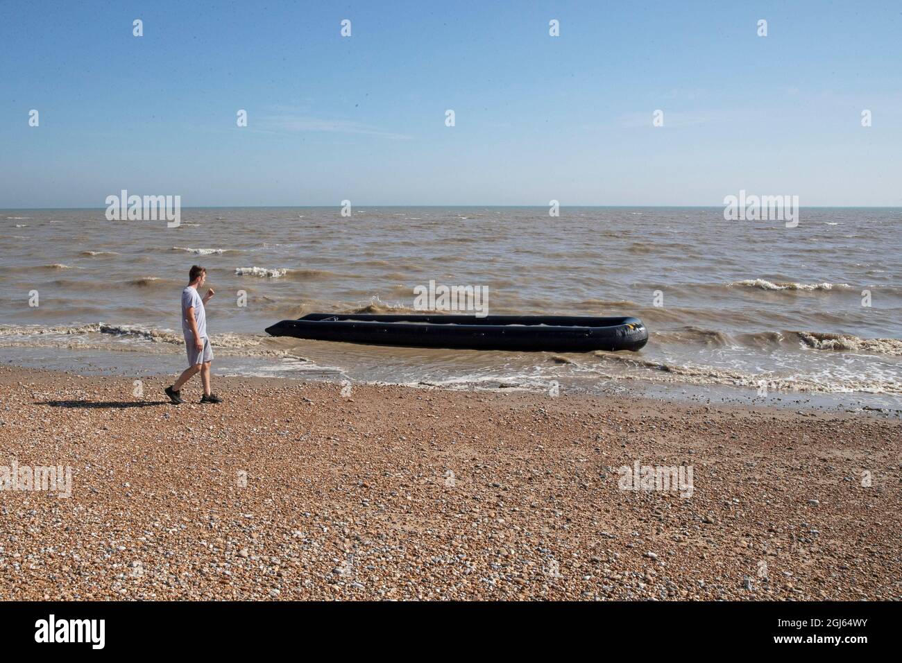 Police with migrants on beach hi-res stock photography and images - Alamy