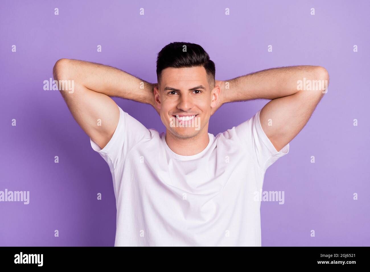 Male model arms behind head hi-res stock photography and images - Alamy