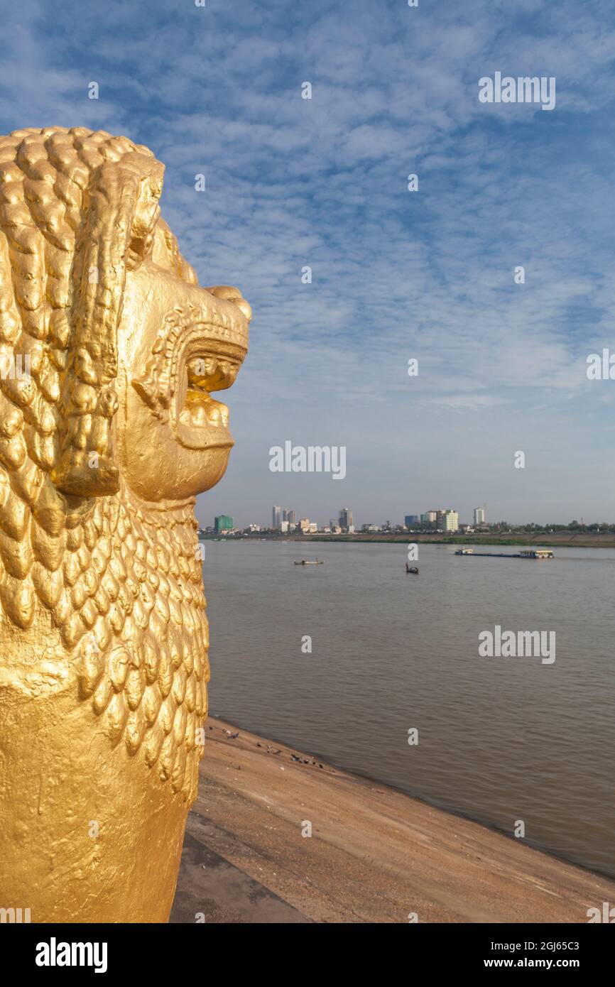 Cambodia, Phnom Penh. Tonle Sap riverfront, golden tiger statue Stock ...