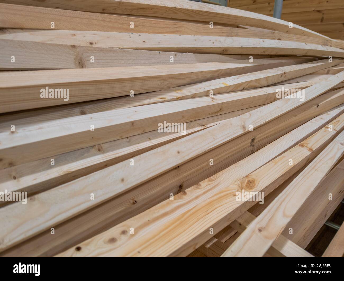 pile of long square section wooden sticks, slightly bent Stock Photo ...