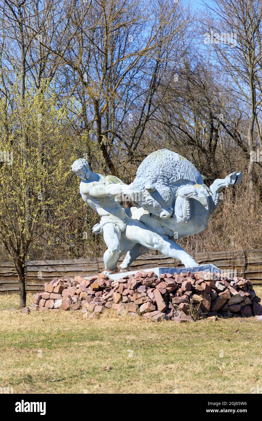 Ukraine, Pripyat, Chernobyl. Sculpture of a man fighting a bull, artist ...