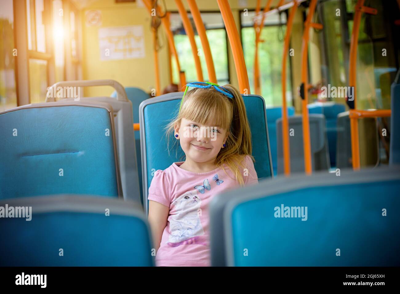 A little girl is going by bus Stock Photo - Alamy