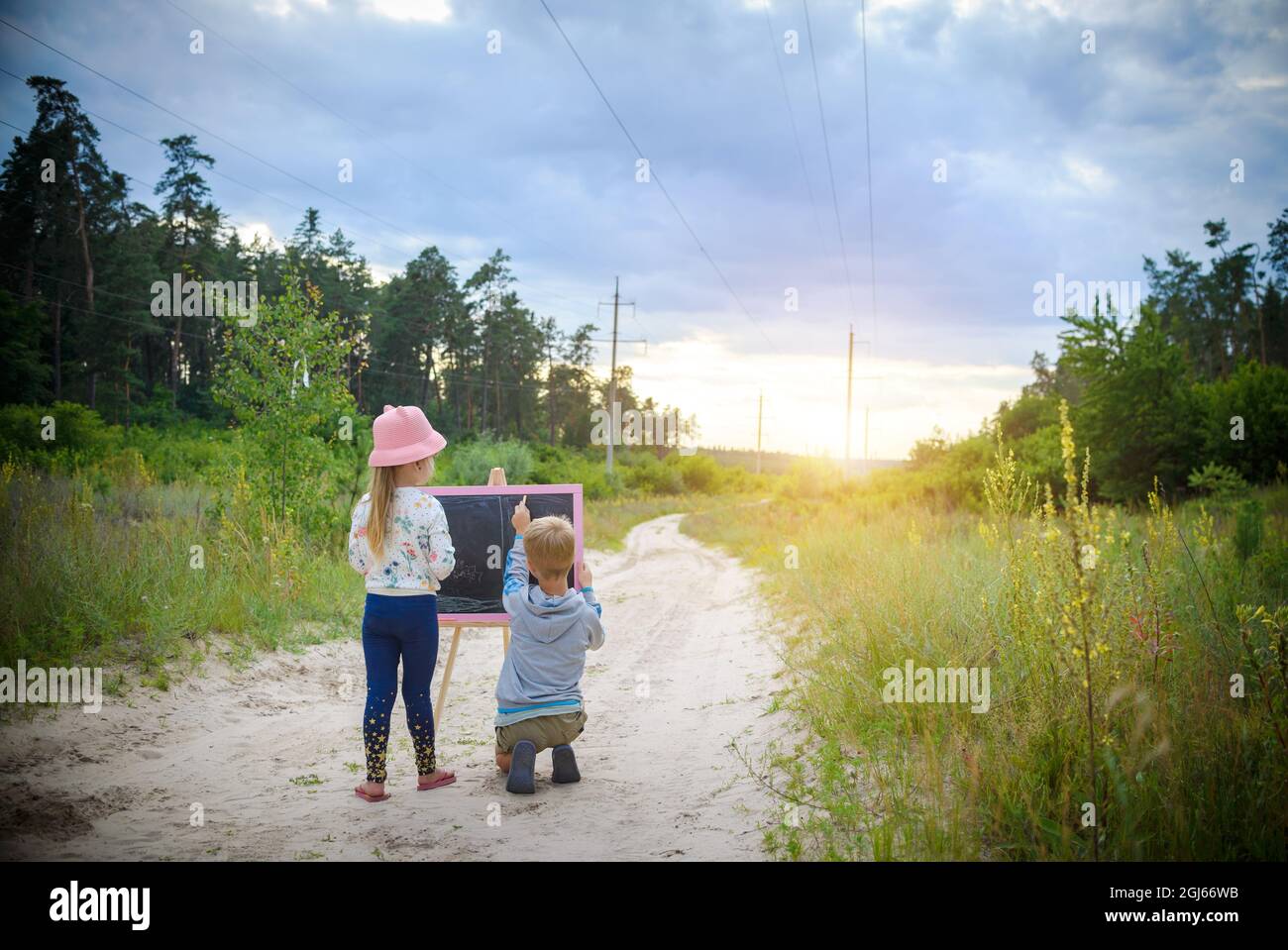 Children draw in the forest Stock Photo - Alamy