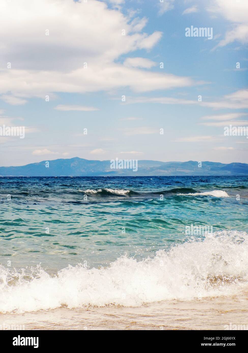 Wave of blue ocean on sandy beach Summer Background Stock Photo - Alamy