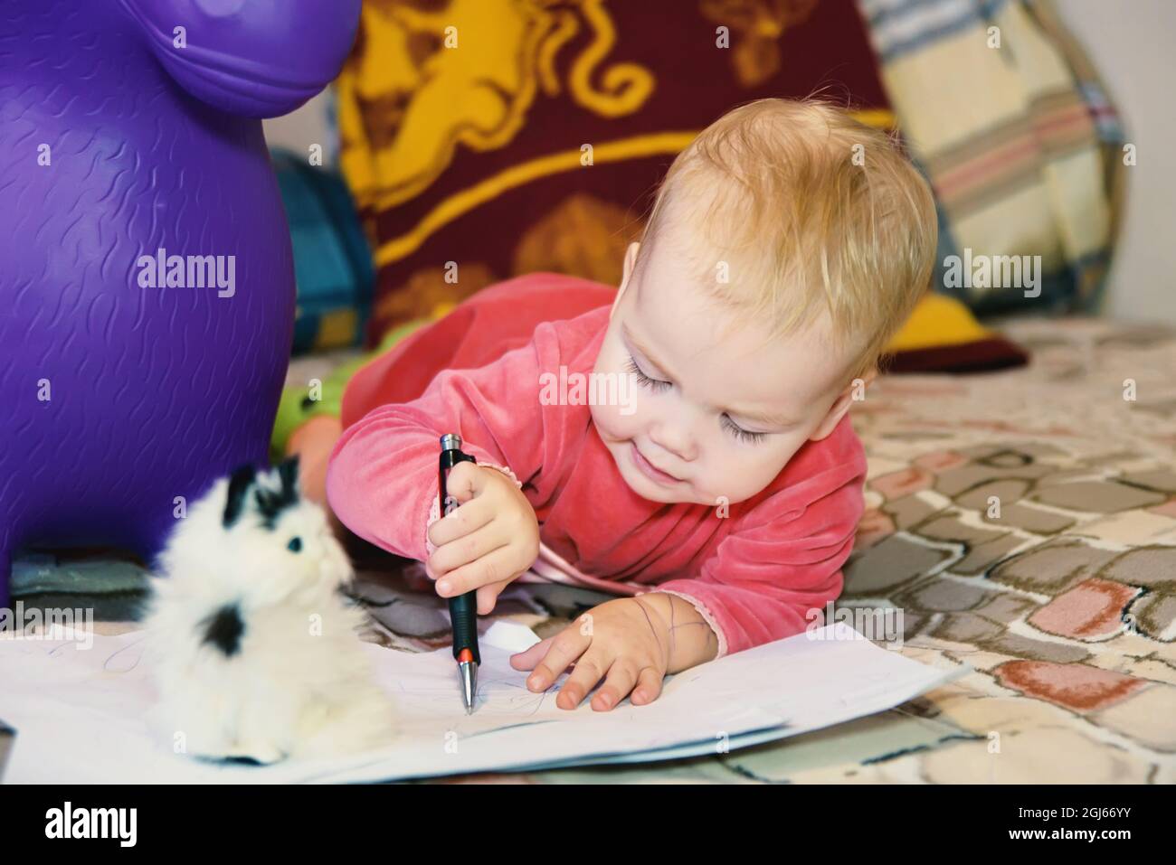 A little child draws with a pen Stock Photo - Alamy