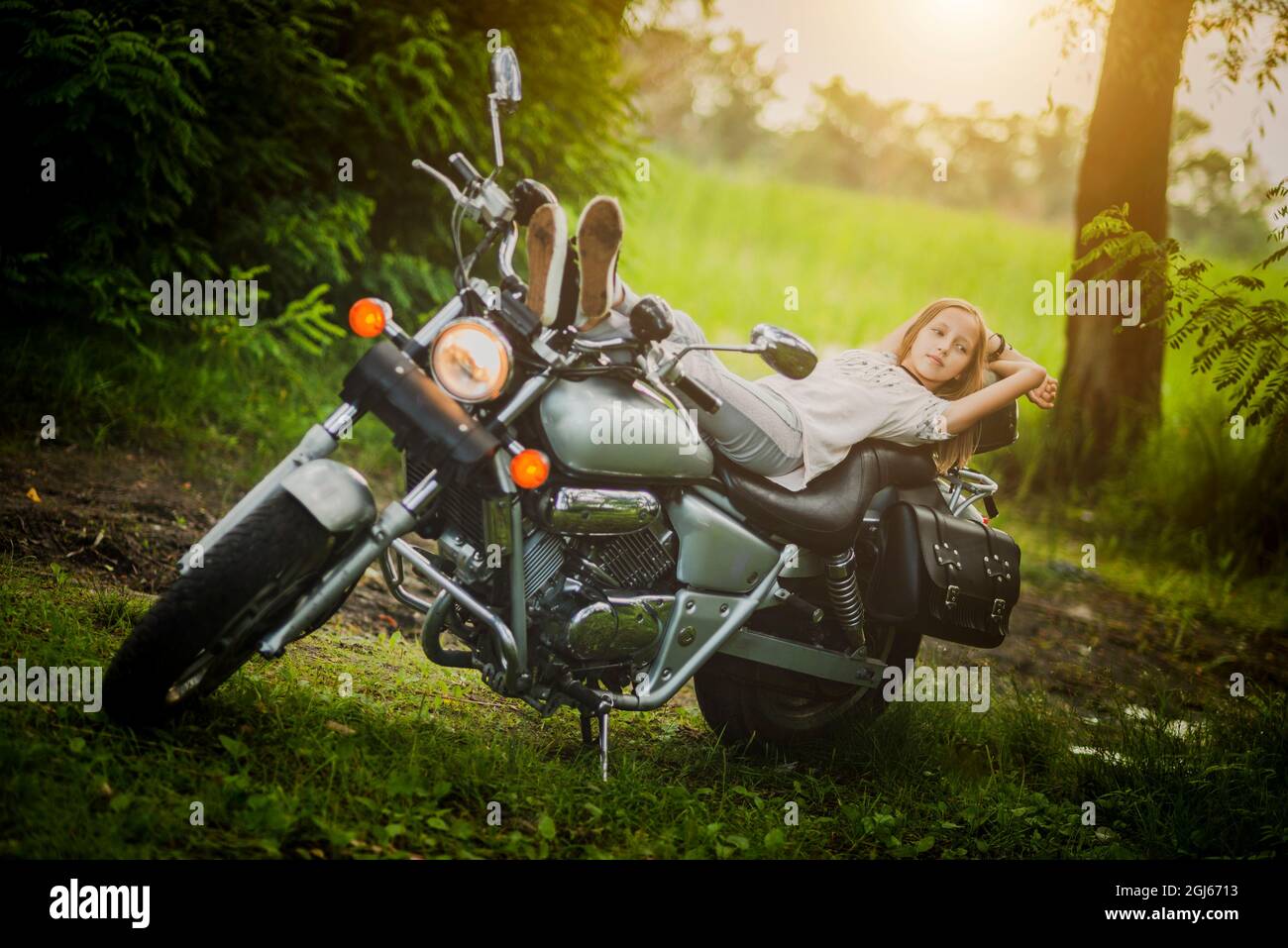Woman lying motorcycle hi-res stock photography and images - Alamy