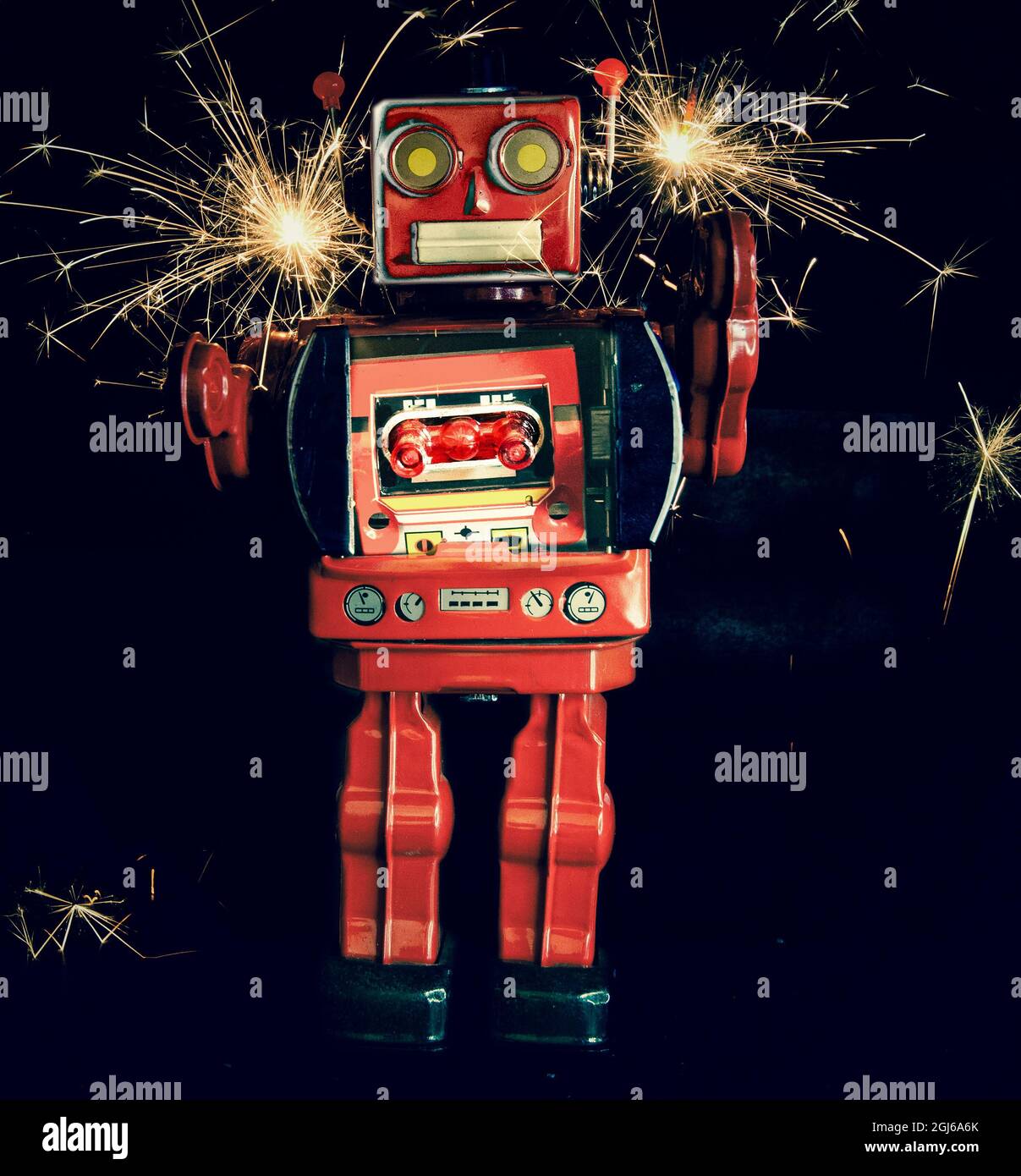retro robot toy with sparks in the dark Stock Photo - Alamy