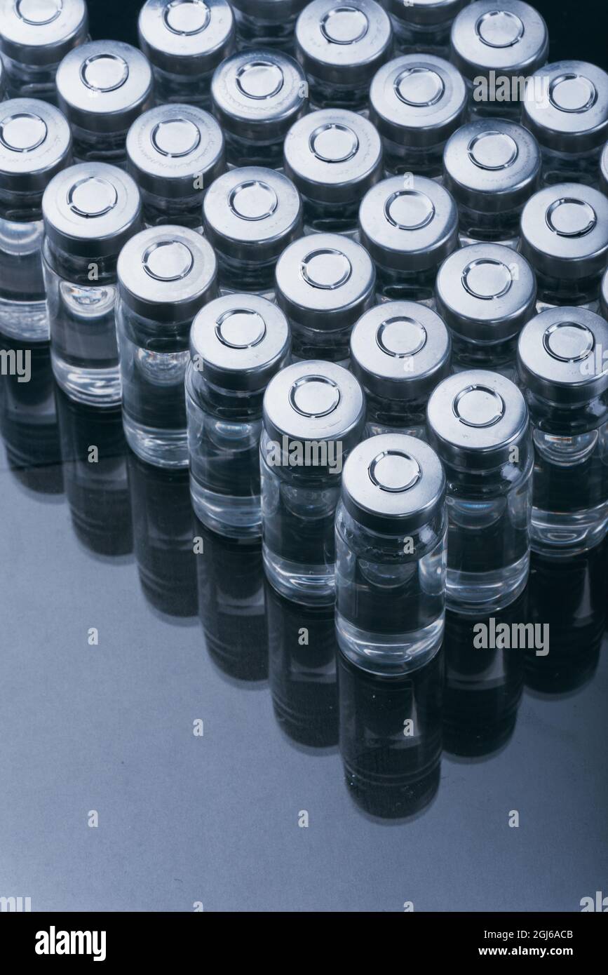 Glass medical ampoule vial for injection. Medicine is dry white drug ...