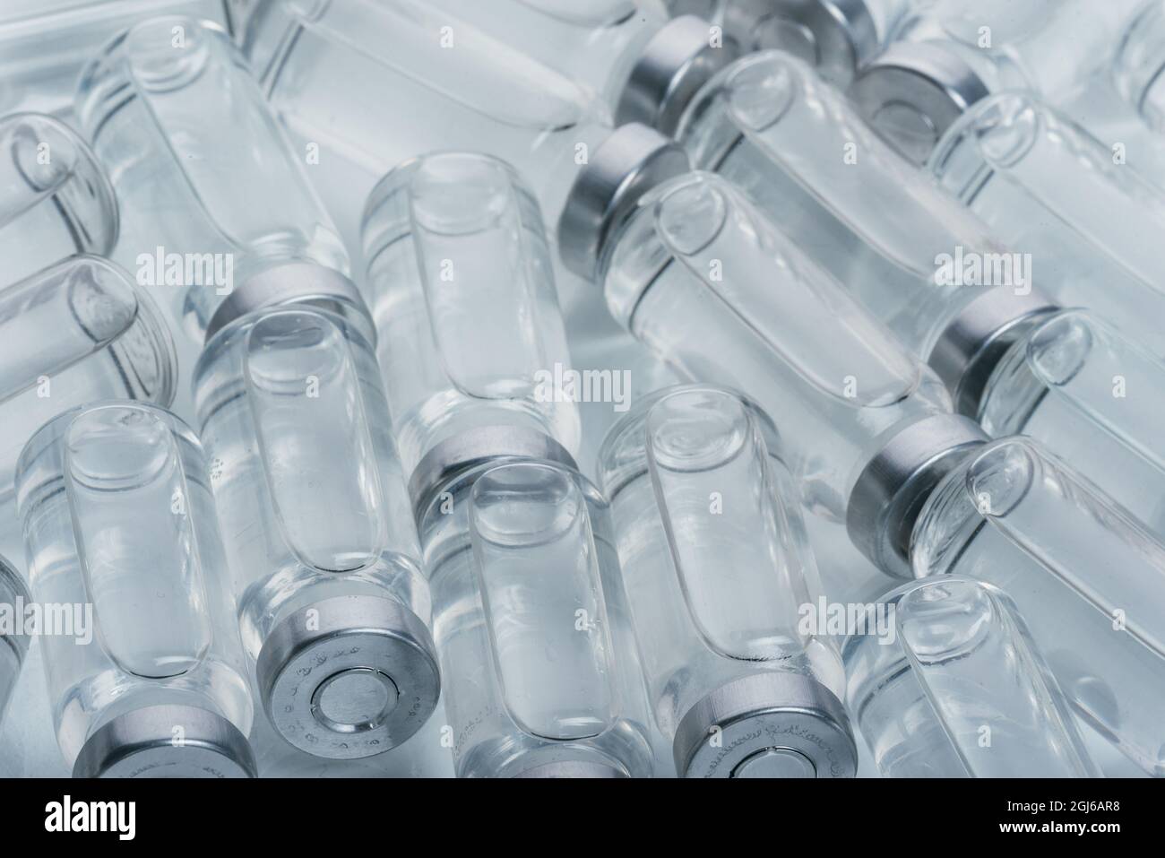 Glass medical ampoule vial for injection. Medicine is dry white drug ...