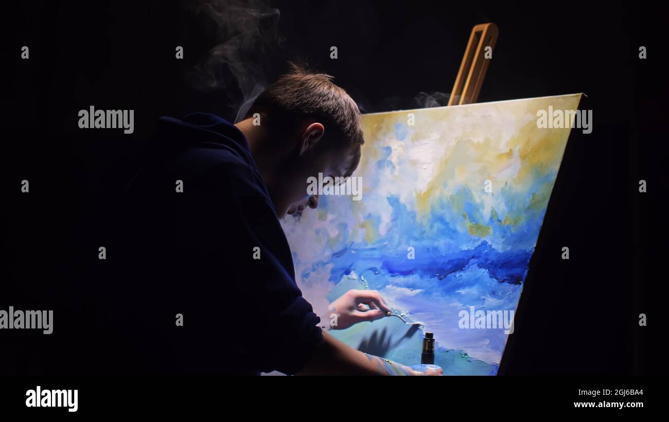 Artist copyist paint seascape with ship in ocean. Vaper smoke vape e ...