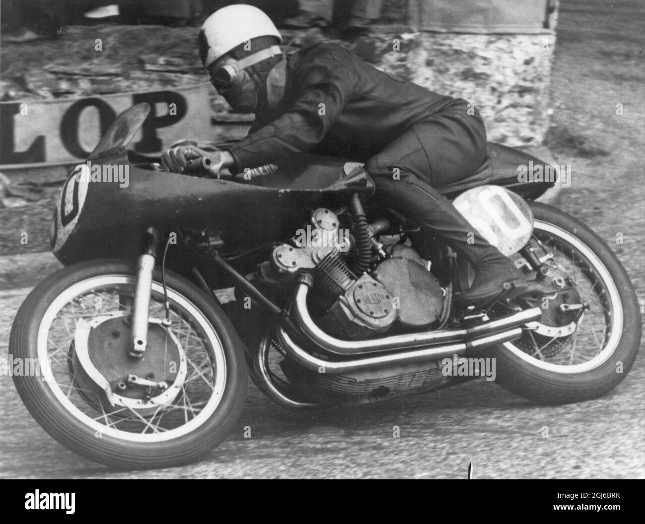 Geoffrey Ernest Duke riding an Italian Gilera (493) during Senior TT ...