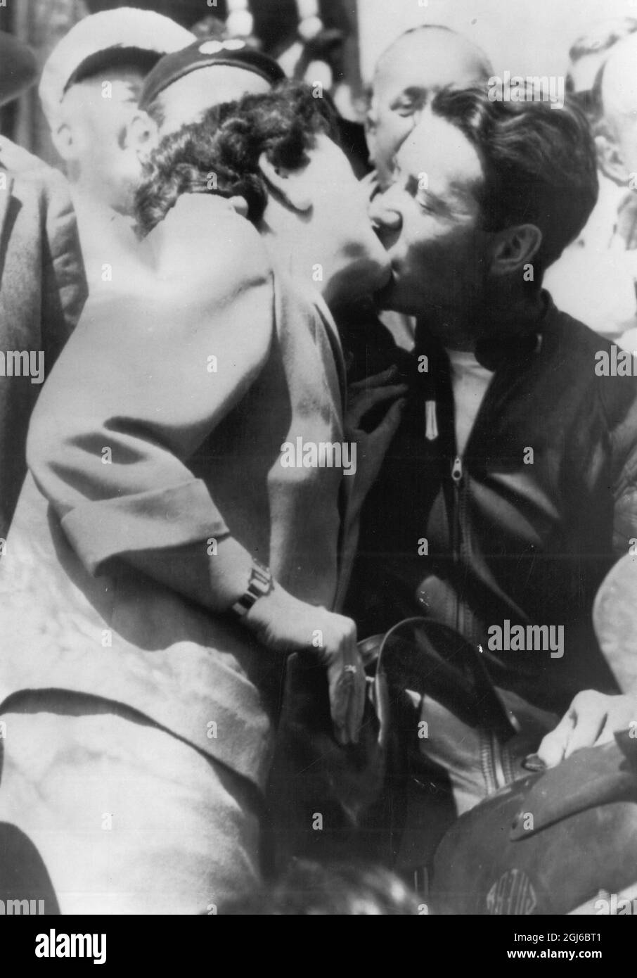 Geoffrey Ernest Duke being kissed by his wife after his victory of ...