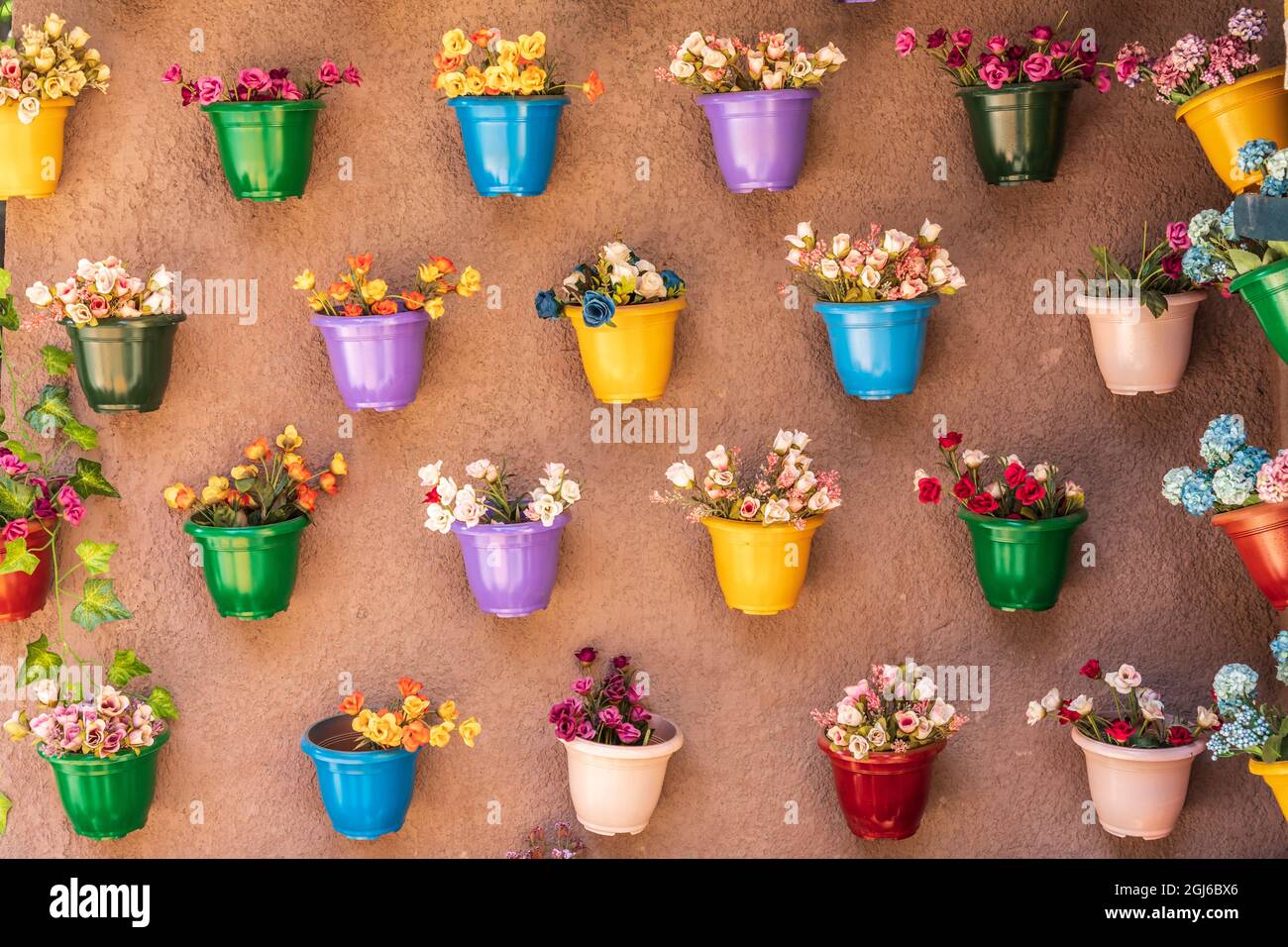 Armenia. Yerevan. Flower pots on the wall of a shop in the Tashir ...