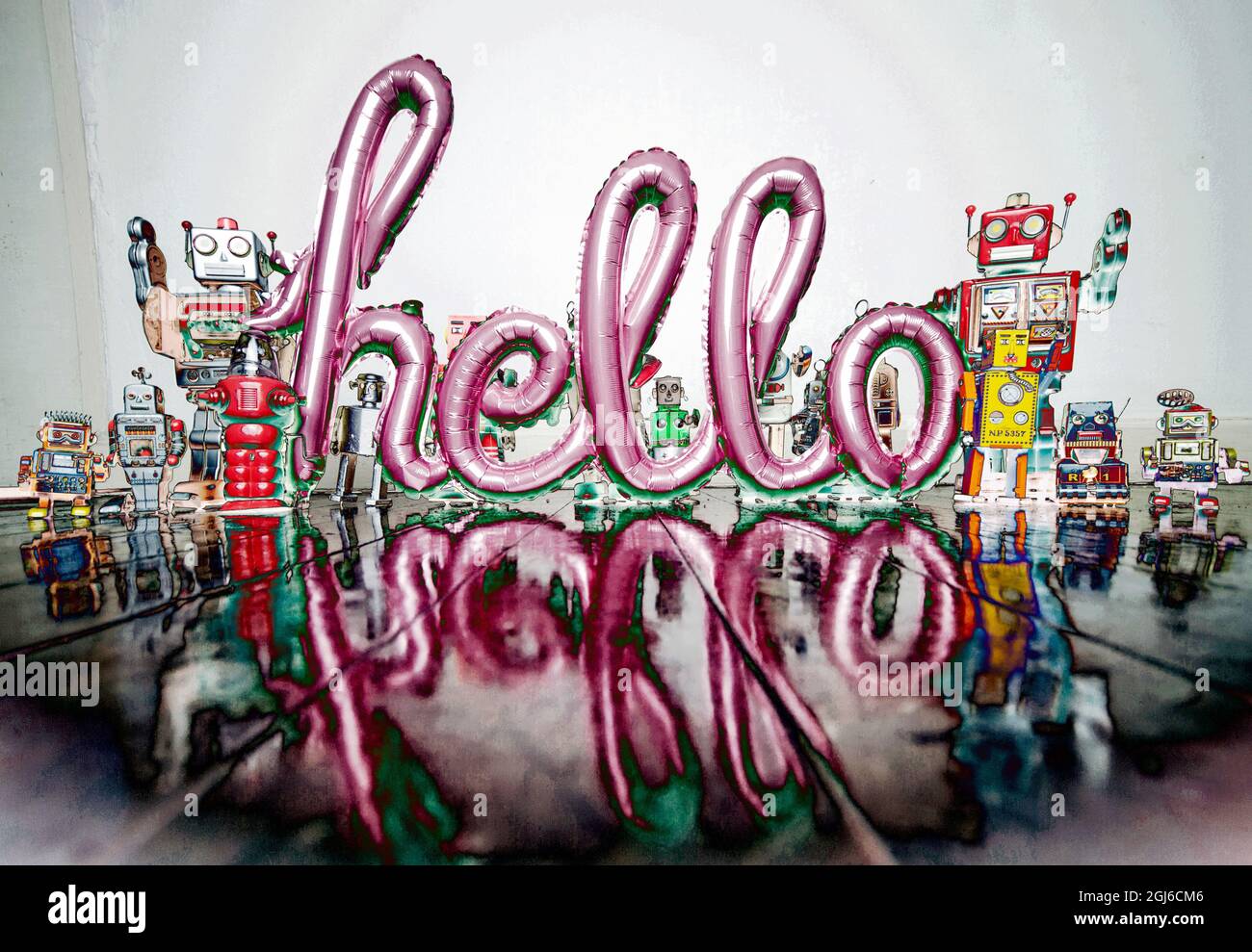 robots holding up the word hello on a old wooden floor with reflection ...