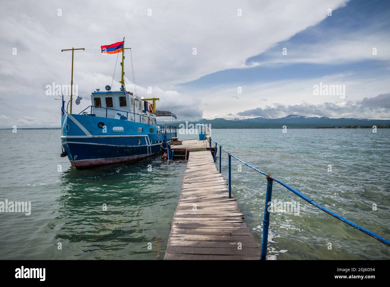 Armenia, Sevan. Small pier with lake boat Stock Photo - Alamy