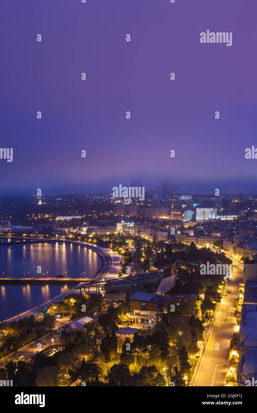 Azerbaijan, Baku. Bulvar Promenade, high angle city skyline with fog ...