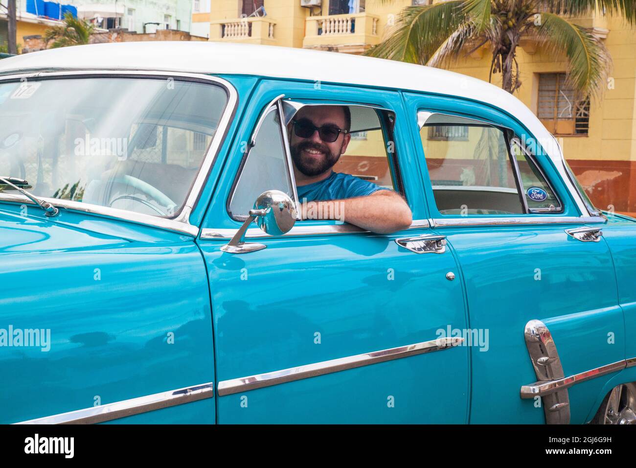 Tourist driving in classic Ford car in Havana, Cuba Stock Photo - Alamy