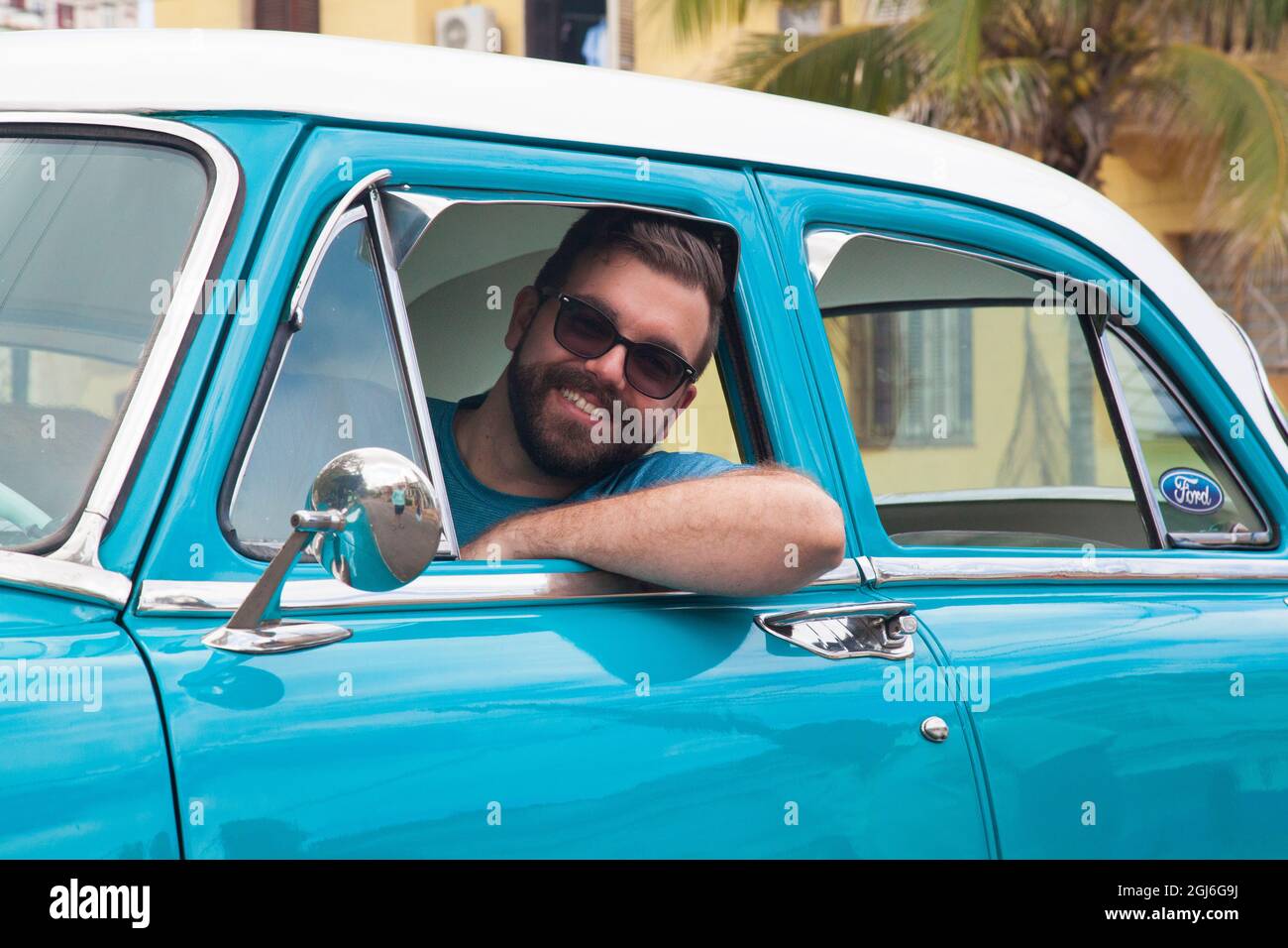 Tourist driving in classic Ford car in Havana, Cuba Stock Photo - Alamy