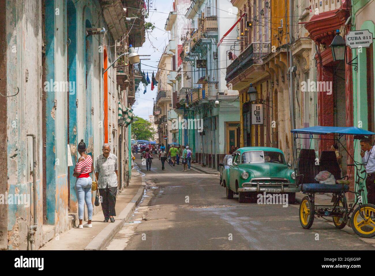 Cars and local Cubans on street in Havana, Cuba Stock Photo - Alamy