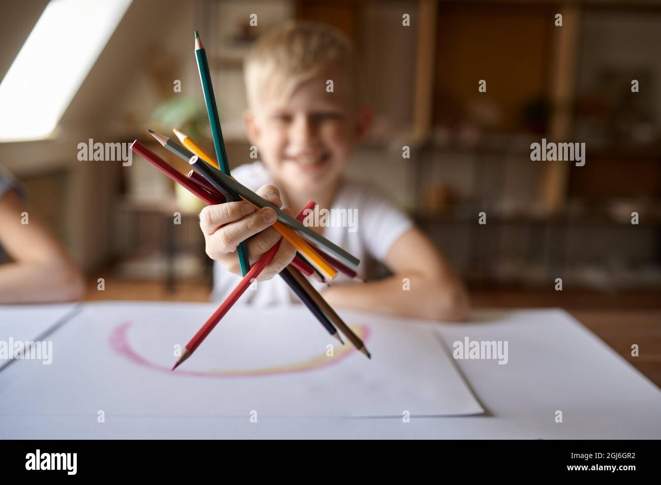 Little boy drawing with pencils, kid in workshop Stock Photo - Alamy