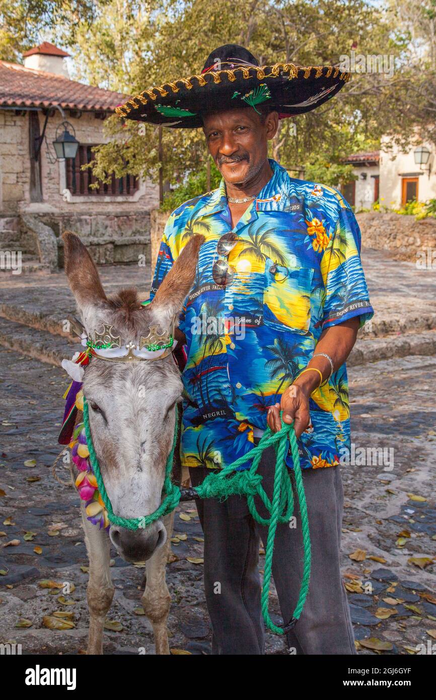 Tourist riding a donkey in Altos de Chavon La Romana, Casa De Campo in ...