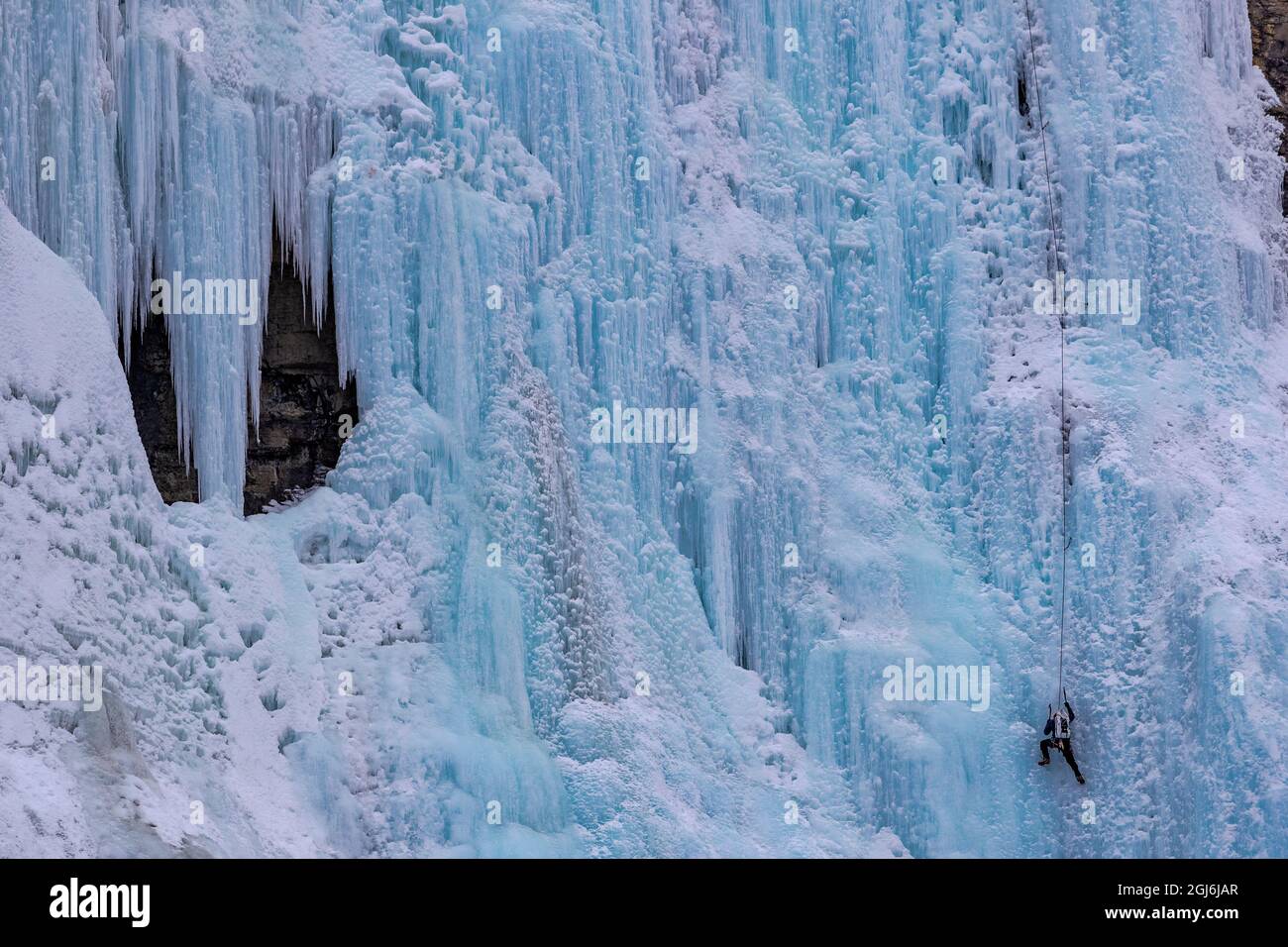 Ice climber on the Weeping Wall icefall in Banff National Park, Alberta ...