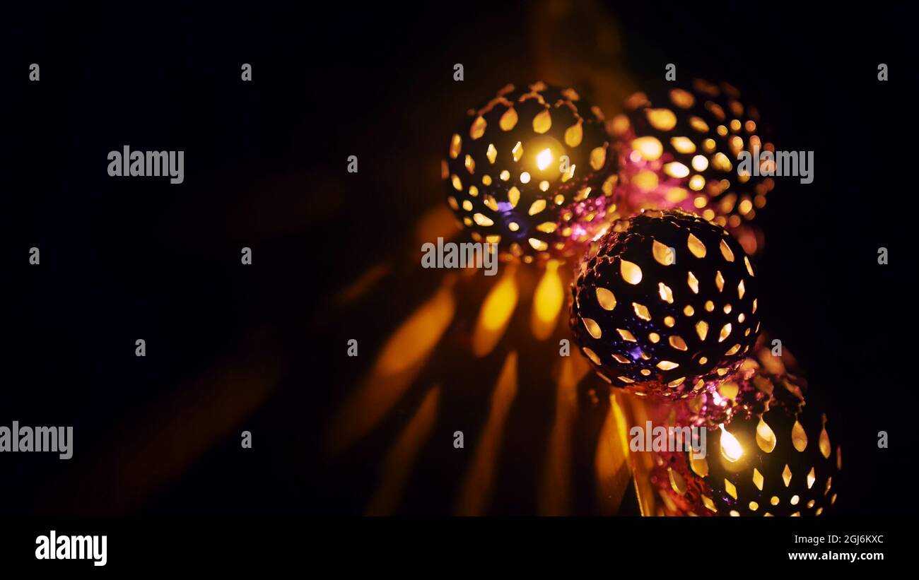 Magic lanterns spin and give beautiful glare to the walls. New Year ...