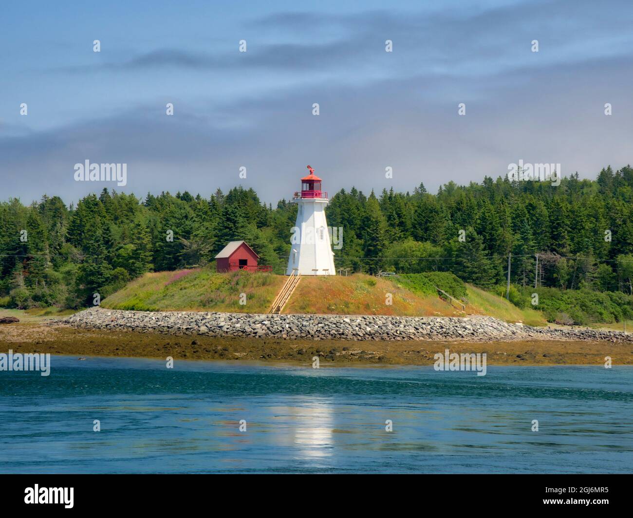 USA, Maine, Lubec. Mulholland Point Lighthouse as seen from the town of ...