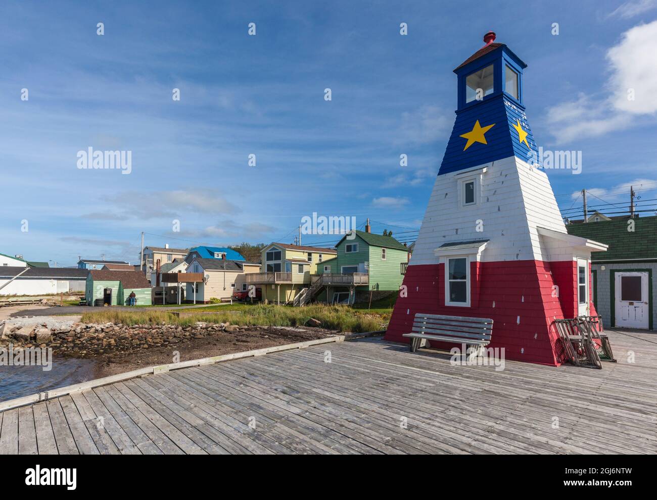 Canada, Nova Scotia, Cabot Trail. Cheticamp, town lighthouse painted in ...
