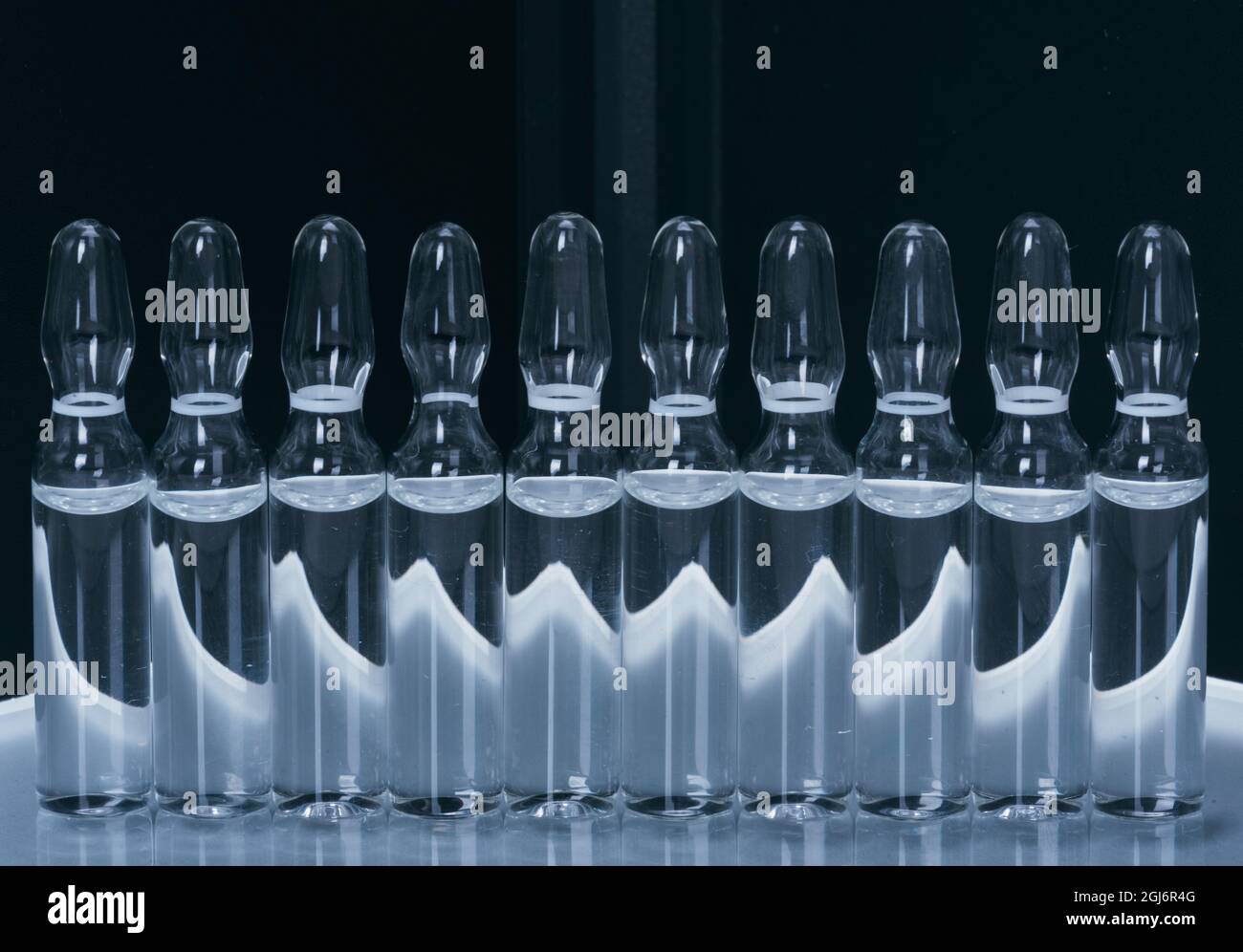 Glass medical ampoule vial for injection. Medicine is liquid sodium ...