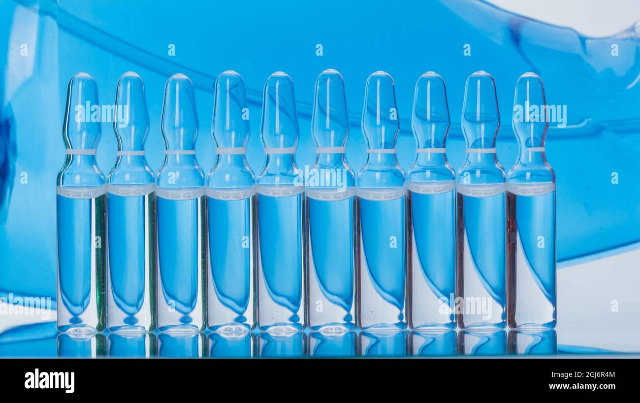 Glass medical ampoule vial for injection. Medicine is liquid sodium ...