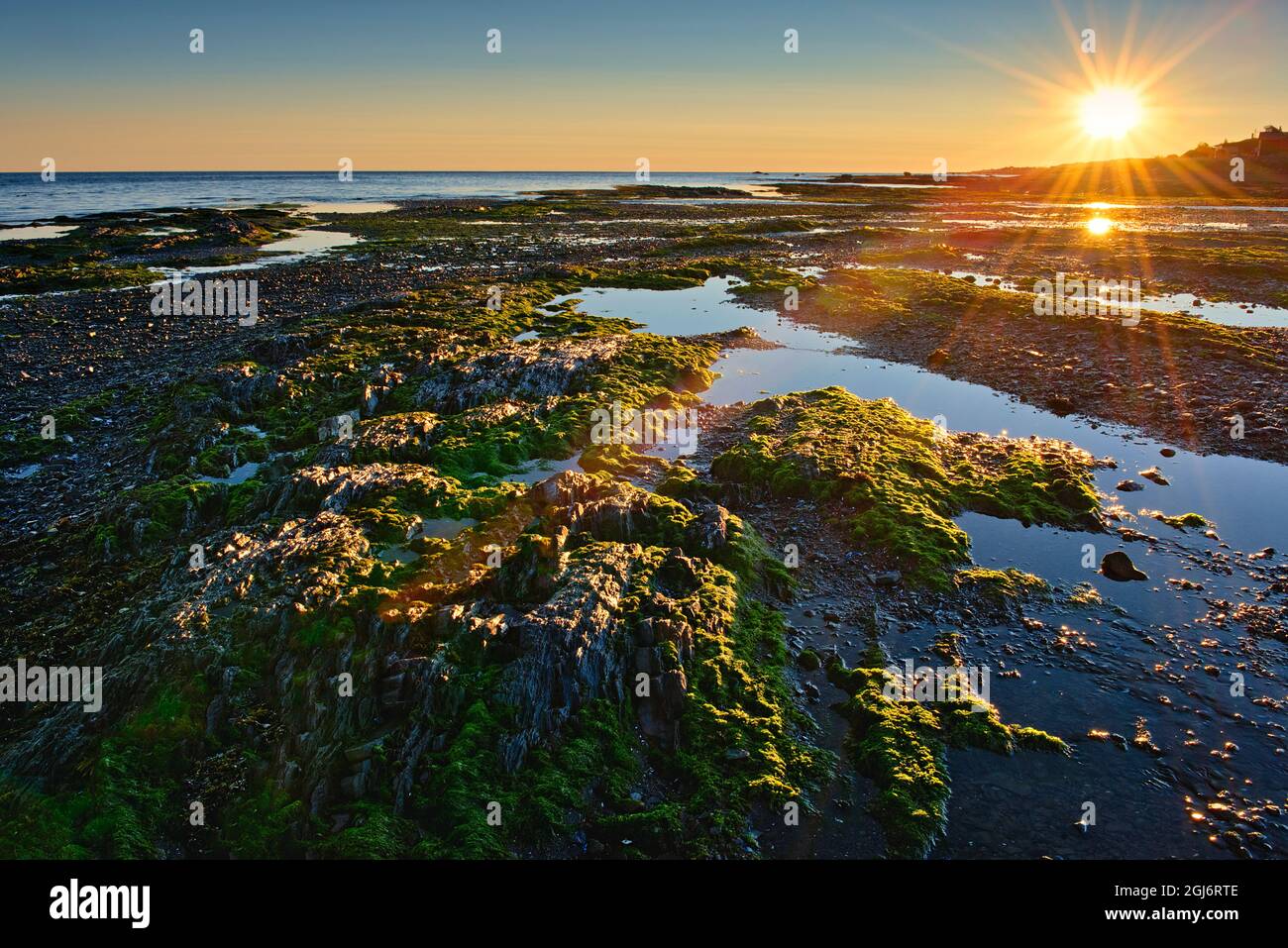 Canada, Quebec, Baie-des-Sables. Rocky coastline along Gulf of St ...