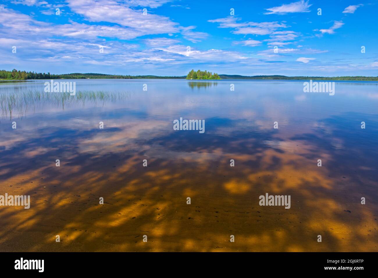 Canada, Quebec, Belleterre. Sunrise reflection on Lac des Sables ...