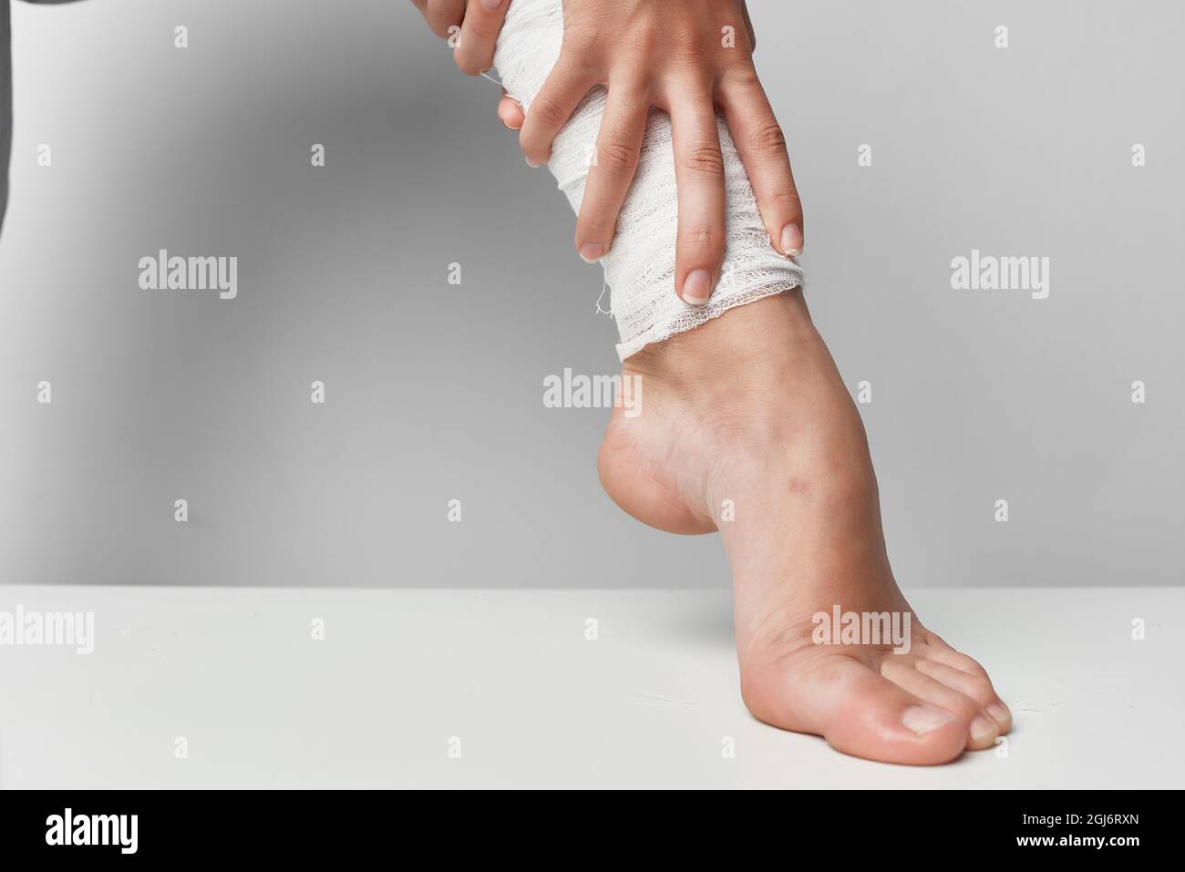 bandaged leg injury close-up health problems Stock Photo - Alamy