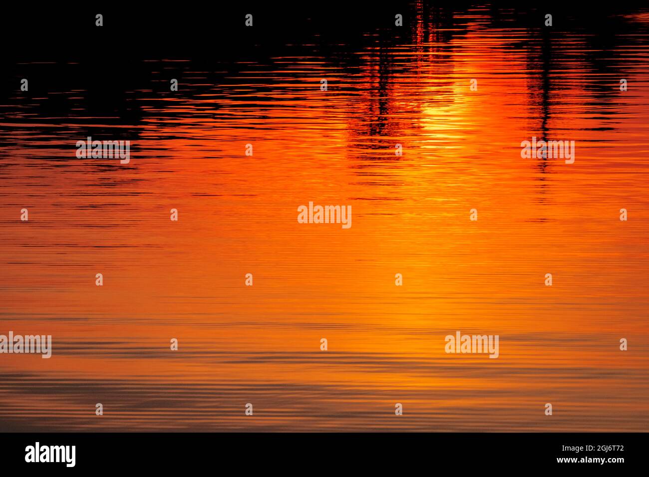 Sunset reflection on lake Stock Photo - Alamy