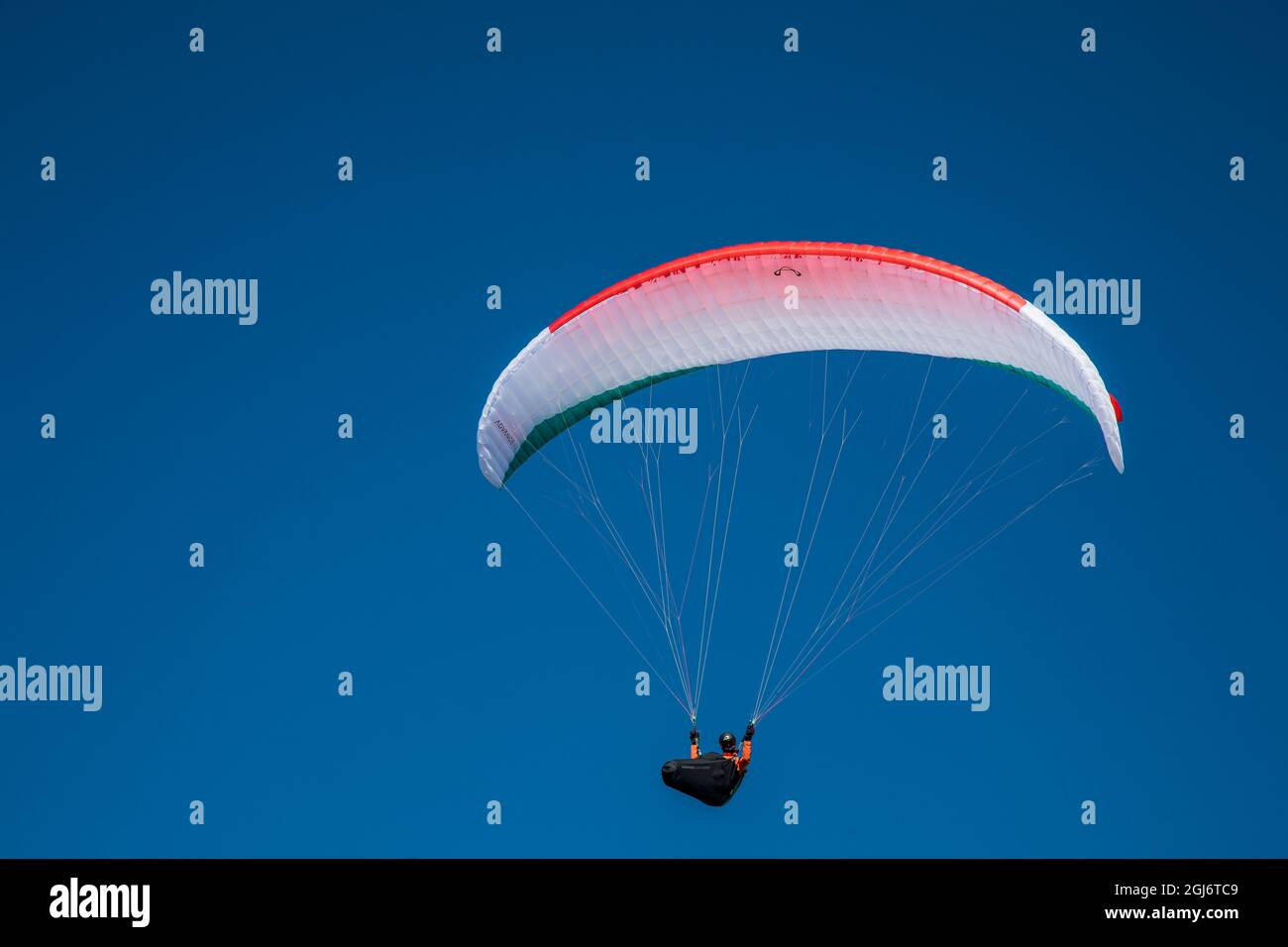 Europe, Austria, Dachstein, Paraglider soaring above Lake Hallstatt and ...