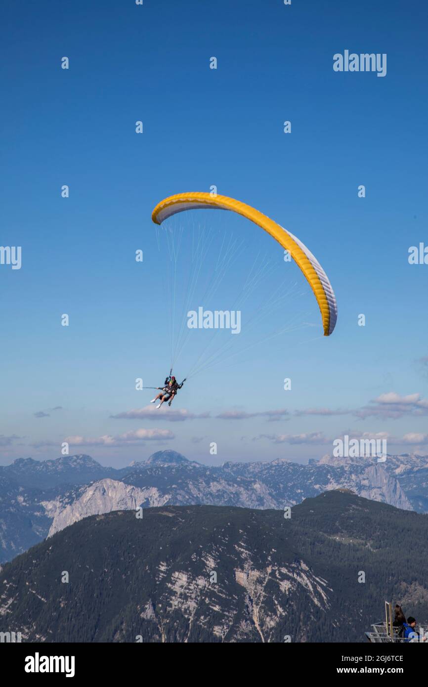 Europe, Austria, Dachstein, Tandem Paragliders soaring above Lake ...