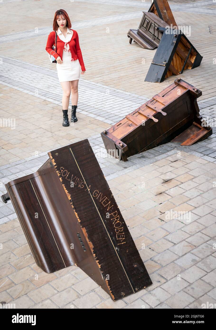 A woman views art installation Floating Pianos by artists' collective ...
