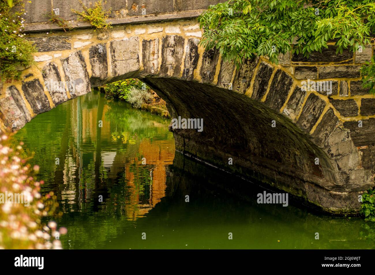 Medieval stone bridge on canal, on canal, Bruges, West Flanders ...