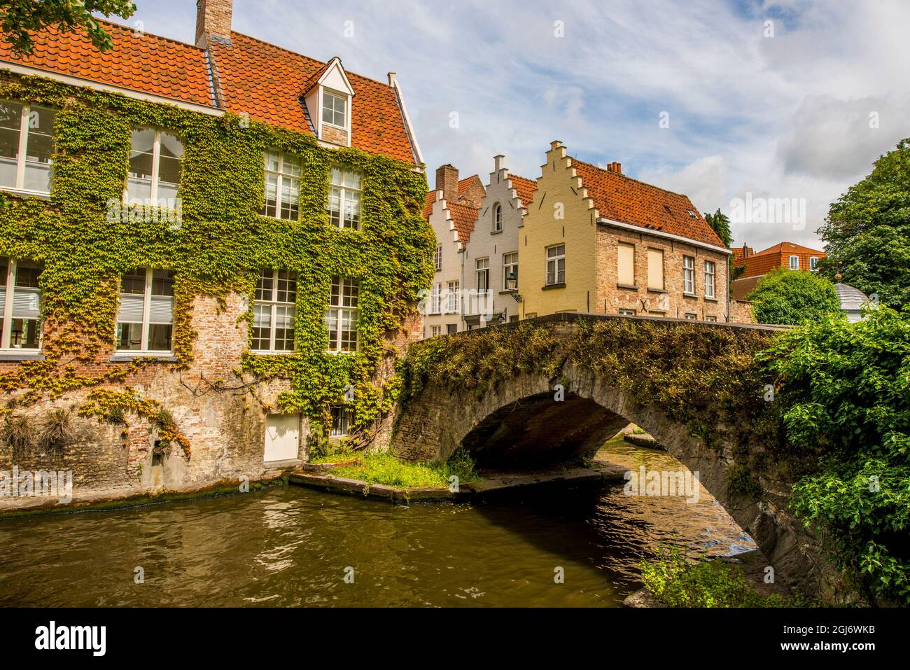Medieval stone bridge on canal, on canal, Bruges, West Flanders ...