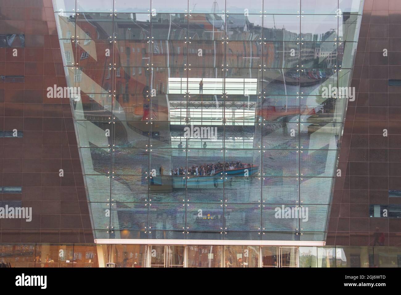 Reflections of the surrounding area in the Black Diamond Building in ...