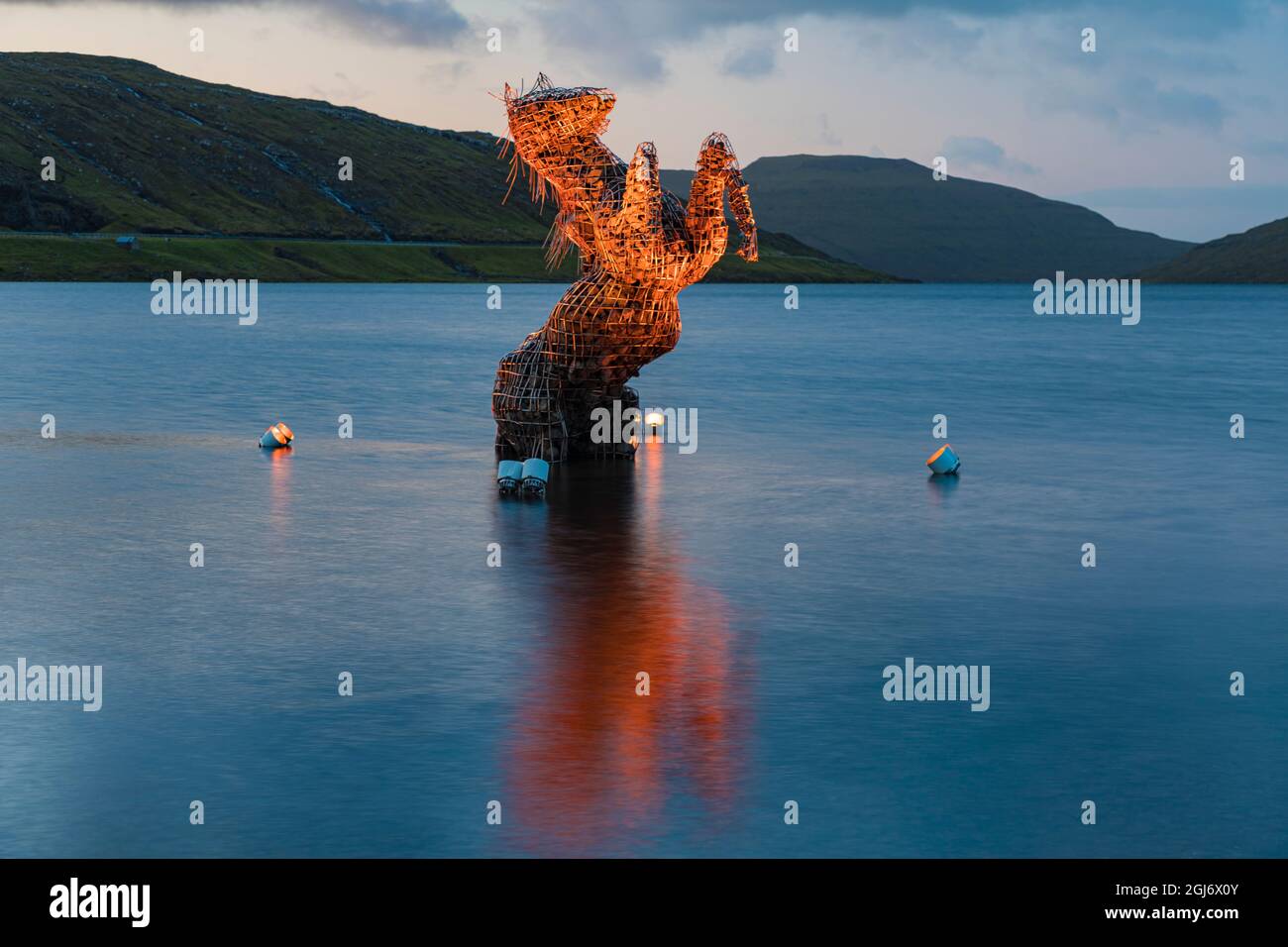 Europe, Faroe Islands. View of the Nix, a statue of the Nix, a mythic ...