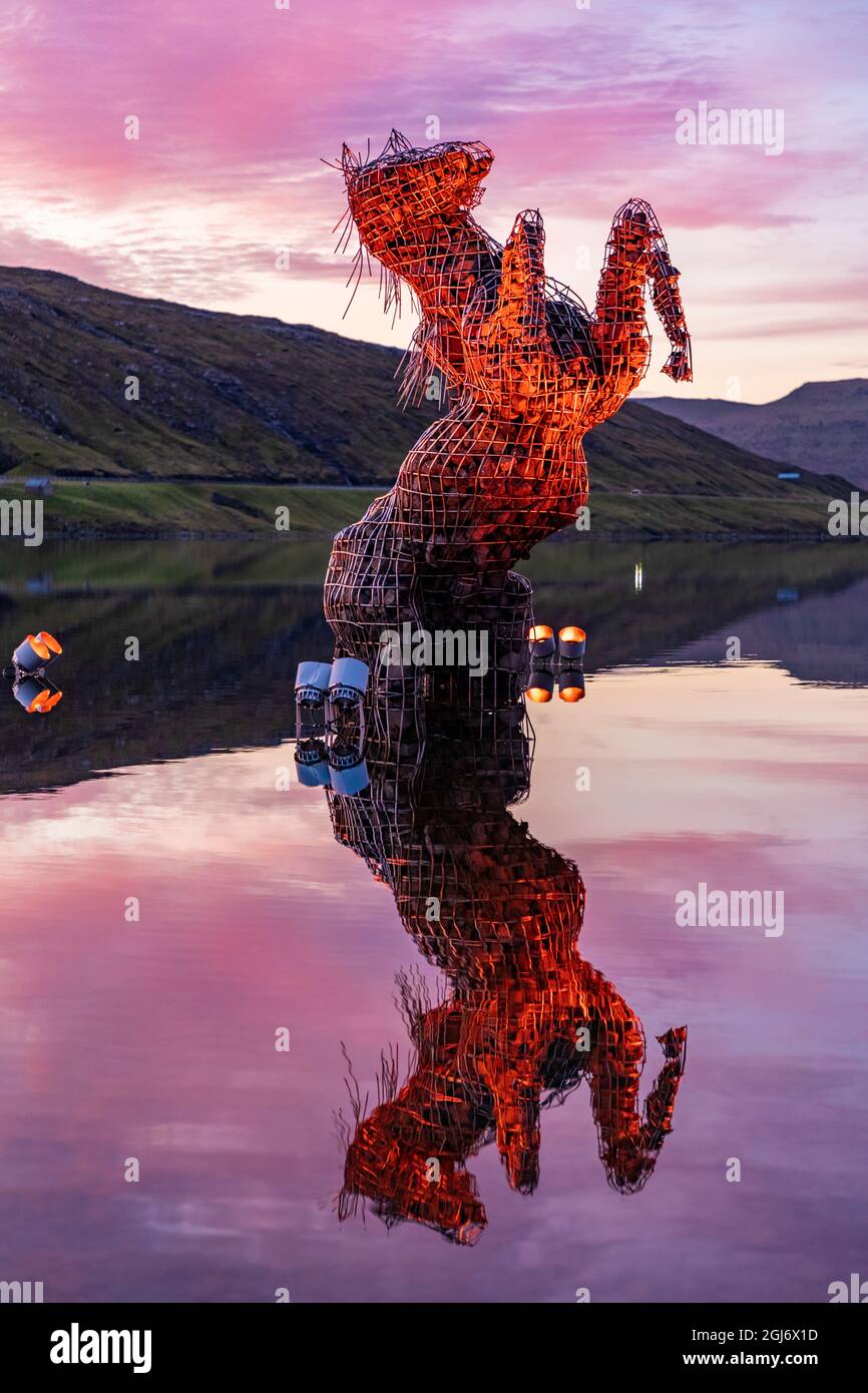 Europe, Faroe Islands. View of the Nix, a statue of the Nix, a mythic ...